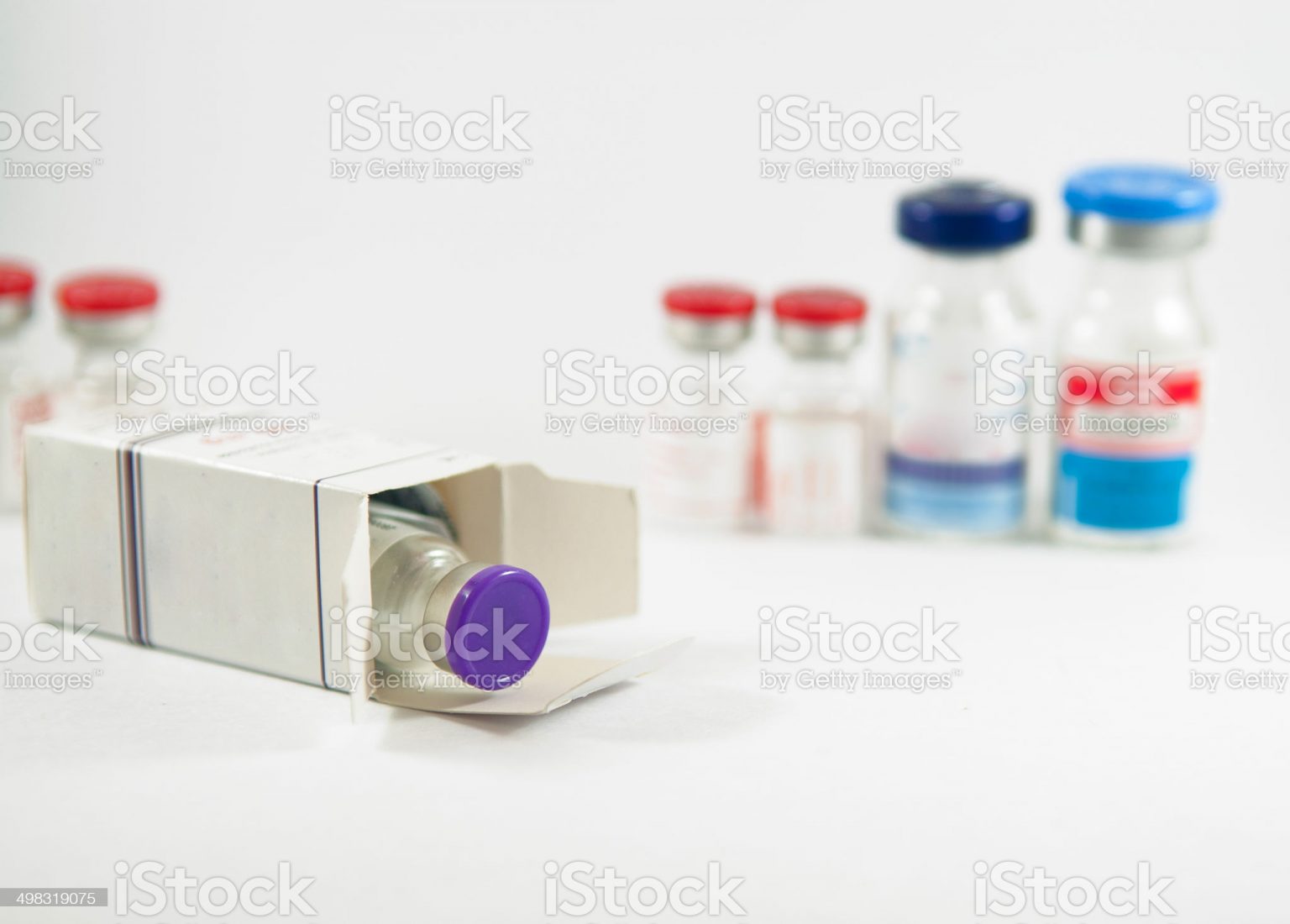 Closed up injection vial in box show medicine concept - InDevR